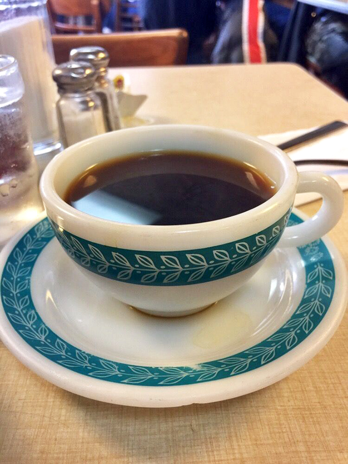 Coffee served in that iconic blue-patterned diner china&mdash;the perfect bitter companion to cut through the richness of your seafood feast.