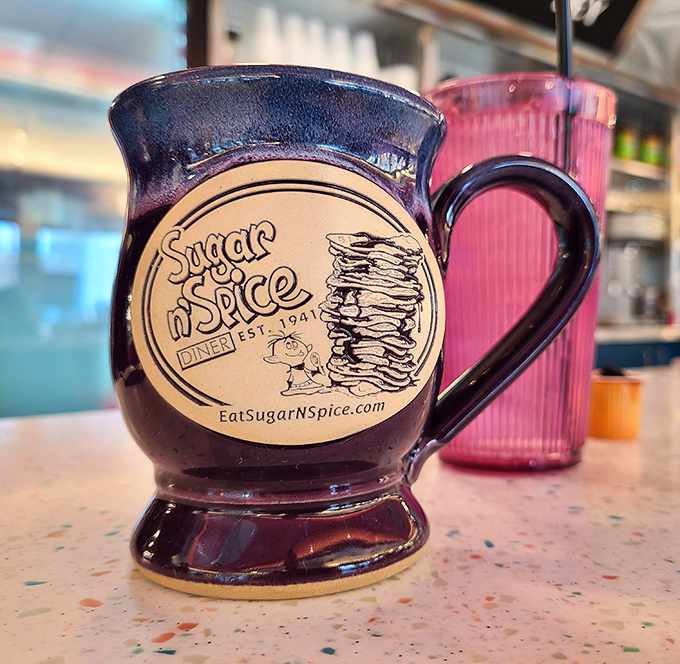 The coffee mug that promises liquid salvation &ndash; sturdy enough to withstand multiple refills during epic breakfast debates.