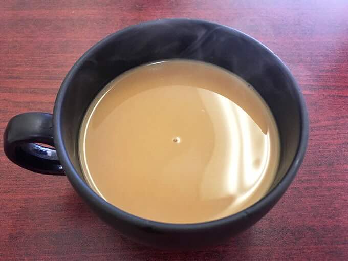 Coffee in a sturdy mug—the unsung hero of every great breakfast experience. No fancy latte art needed when the brew is this good.