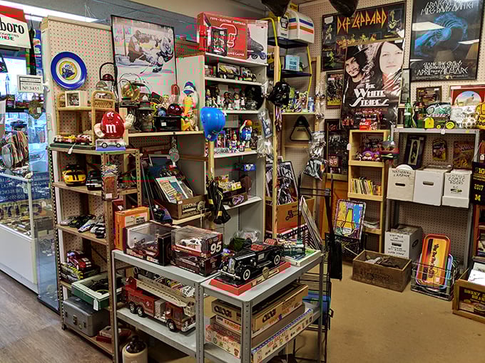 Rock band posters neighbor vintage toy trucks in this collector's paradise. The M&M figurine has seen more decades than he's letting on.