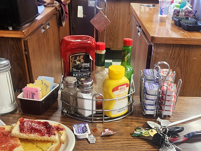 The condiment caddy&mdash;that miniature United Nations of flavor where ketchup, mustard, and hot sauce negotiate the terms of your meal's final taste.