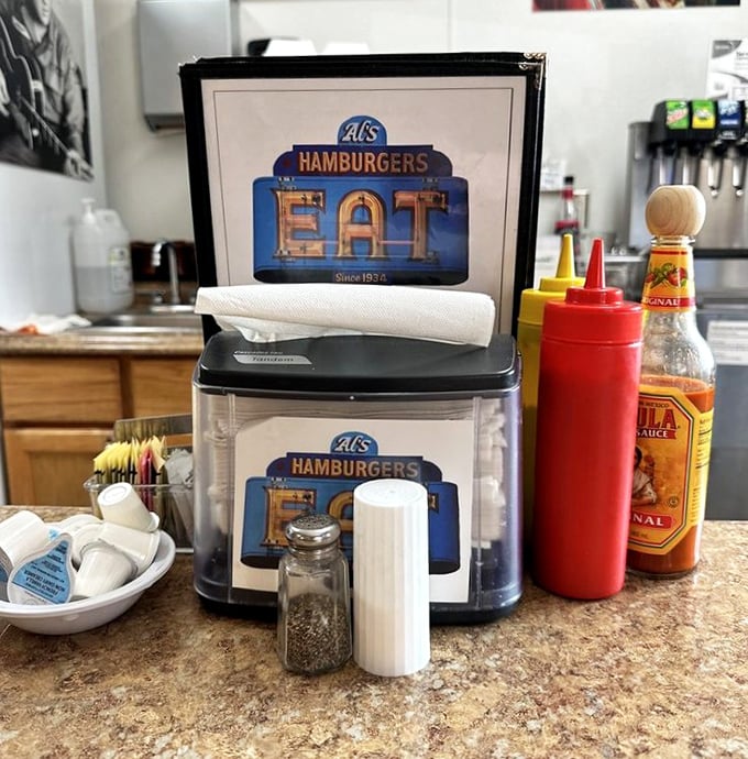 The condiment station at Al's—where ketchup and mustard bottles aren't just containers, they're magic wands waiting to enhance your burger experience.