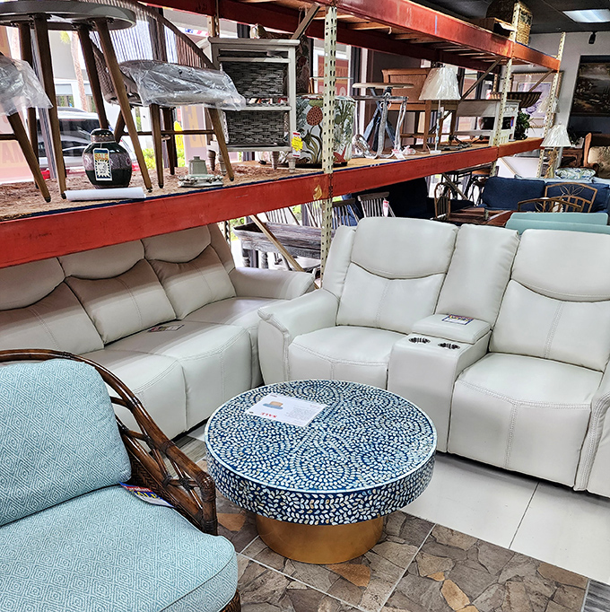 The leather sectional and mosaic table create a conversation pit that practically begs for friends, wine, and those stories you only tell after the second glass.