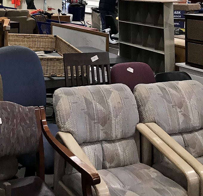 The furniture section: where retired recliners and gently-used armchairs wait for their second act. That pattern screams "I survived the '90s!"