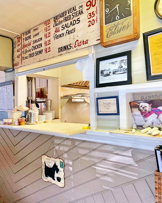 The pass-through window offers a glimpse into breakfast magic headquarters. Those vintage menu boards have stories to tell.