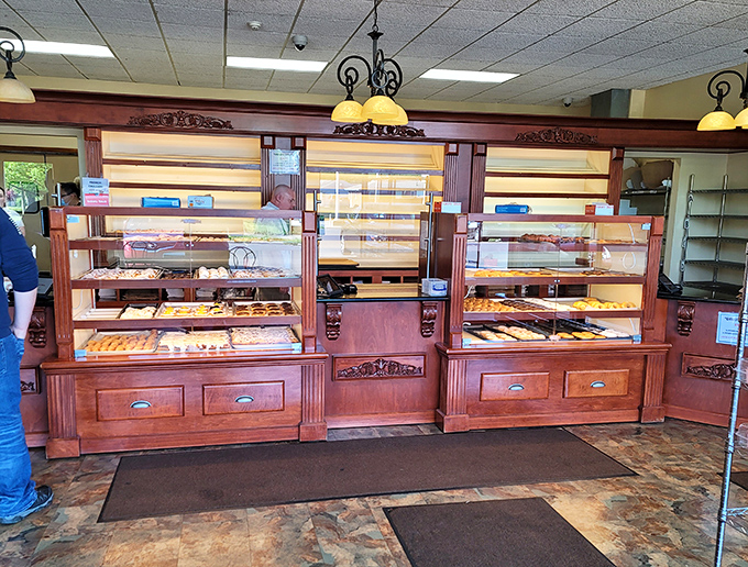 The display cases that have launched a thousand "I'll just have one" lies. Wooden craftsmanship almost as impressive as the pastries within.