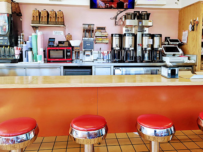The coffee station stands ready for duty, its army of carafes prepared to provide the perfect bitter counterpoint to sweet donut bliss.