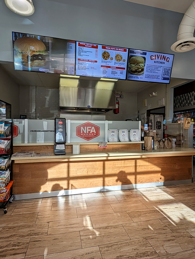 Sunshine streams across the counter where burger magic happens. Clean lines, efficient design, and that menu board promising delicious possibilities.