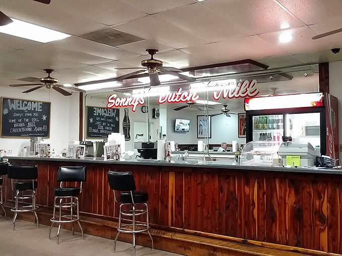 The counter where magic happens. That neon sign isn't just decoration - it's a beacon of hope for the hungry and hurried.