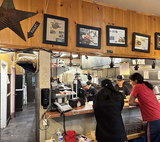 Framed accolades line the walls while staff members work the counter. The real trophies, however, come from the smoker out back.