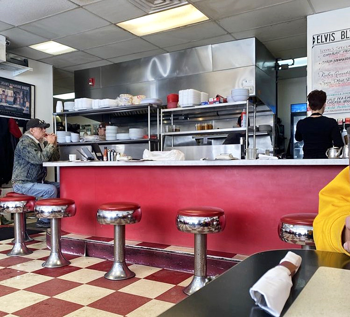 The counter seating&mdash;where solo diners become temporary family and the coffee refills appear before you even realize you need one.