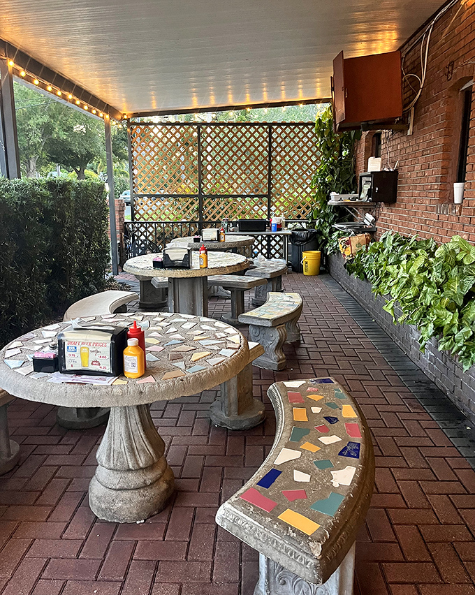 The patio's mosaic tables tell stories of countless meals shared under string lights. Florida dining at its most authentic.