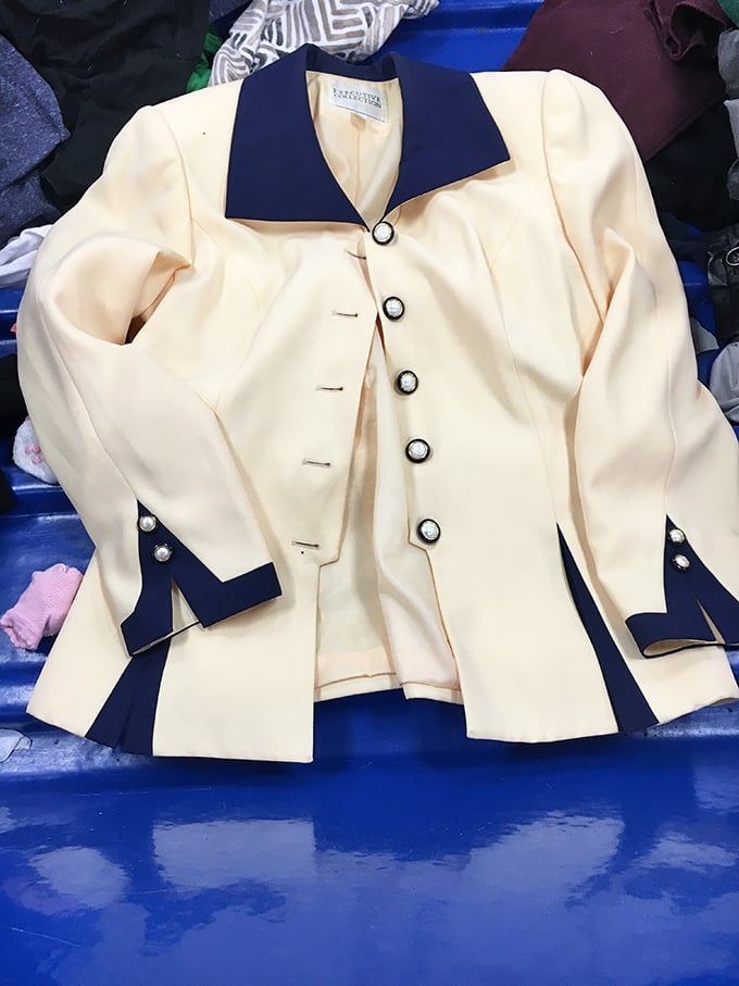 Vintage-inspired elegance with nautical flair. This cream and navy blazer could take you from job interview to yacht party&mdash;neither of which you told it about.