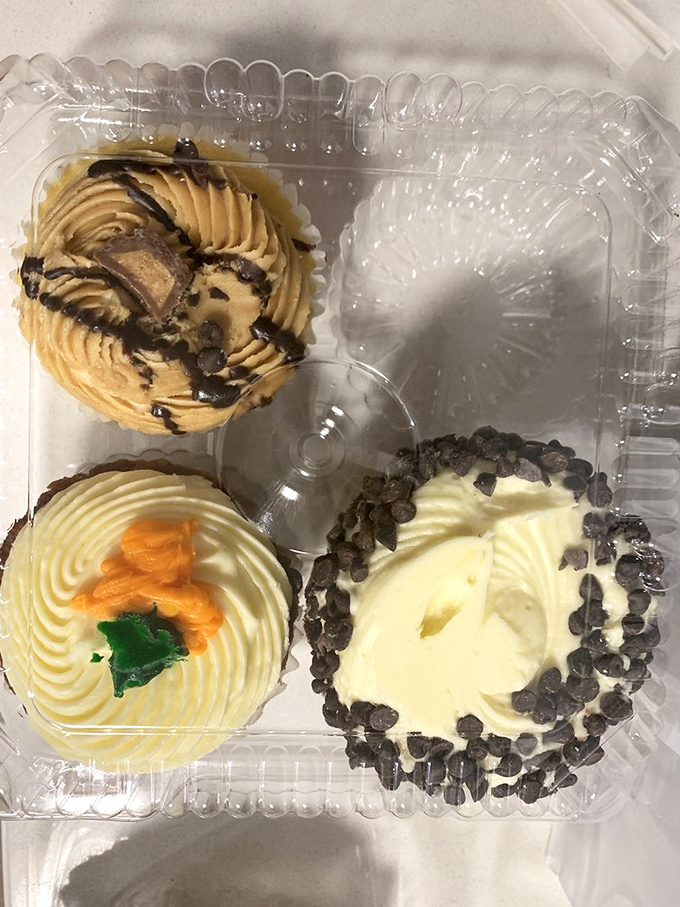 Cupcakes with frosting swirls so perfect they look computer-generated. The peanut butter chocolate one is practically winking at you.