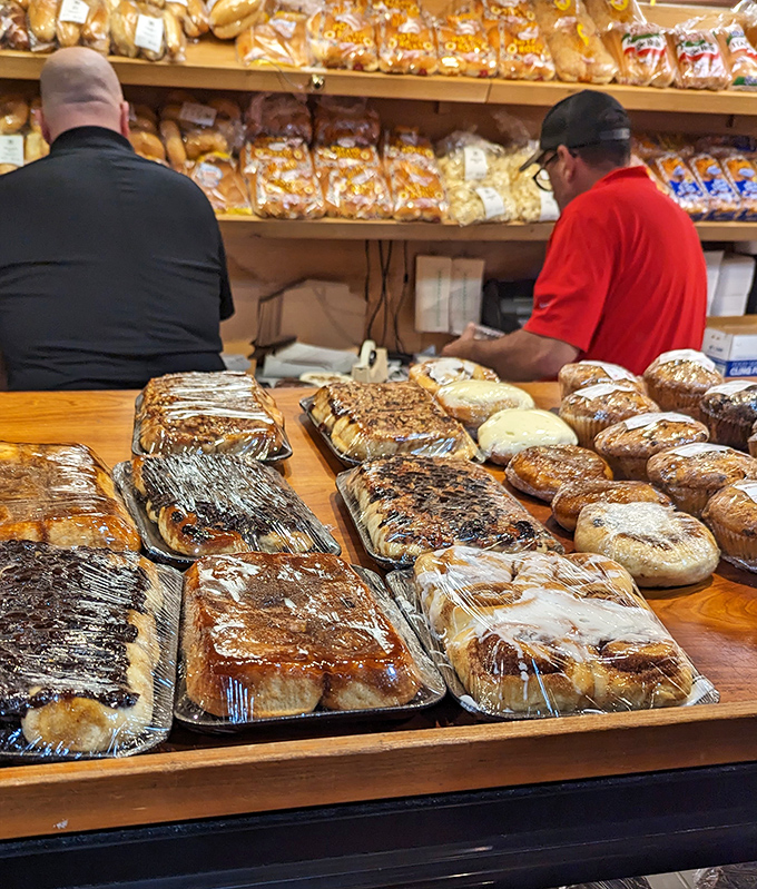 The universal language of pastry appreciation brings people together at the counter, united in their quest for the perfect bite.
