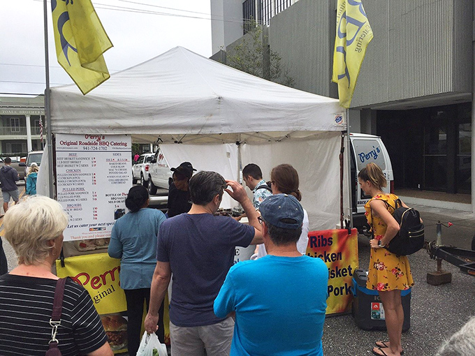 Happy customers experiencing what might be the highlight of their Florida vacation. The sauce-stained smiles tell all.