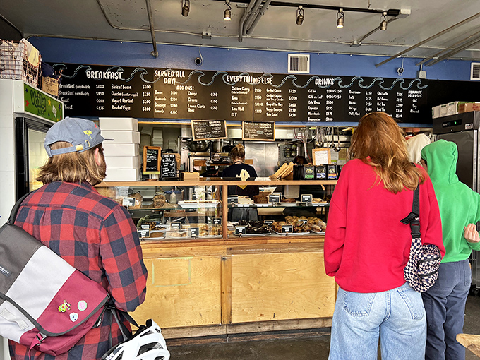 The morning queue forms with purpose&mdash;strangers united by the universal language of "I need that biscuit sandwich in my life."