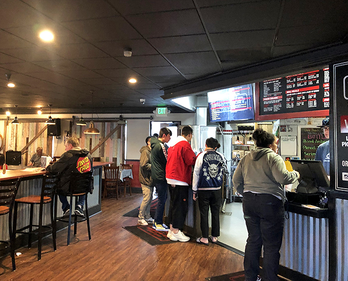 Happy customers united by sauce-stained fingers and the universal expression of barbecue bliss.