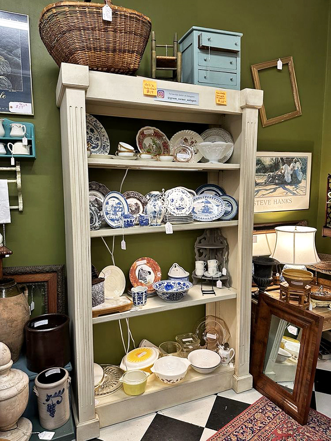 Fine china and porcelain treasures await new homes, each piece having survived decades of careful handling to reach this display shelf.