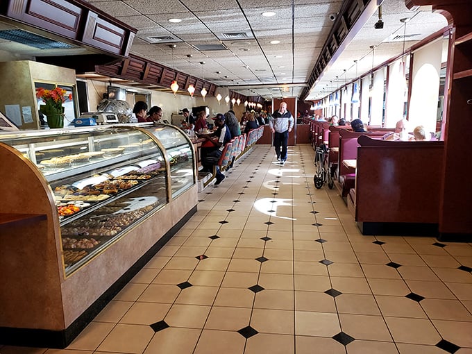 The dessert case and counter seating&mdash;where solo diners become temporary members of the extended diner family.