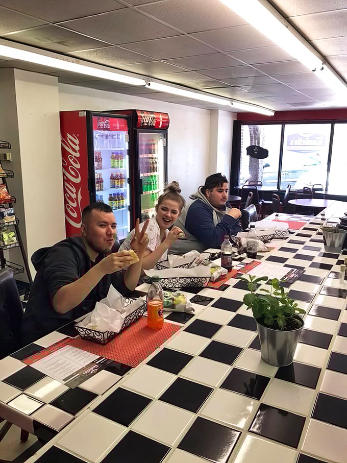 Happy customers caught in their natural habitat – the universal language of sandwich satisfaction transcends all barriers.