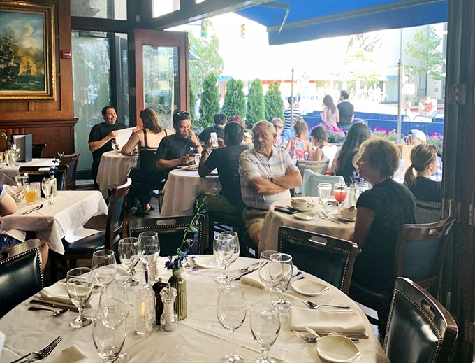 Where seafood stories are shared and memories made&mdash;notice how nobody's looking at their phones? That's the power of really good food.