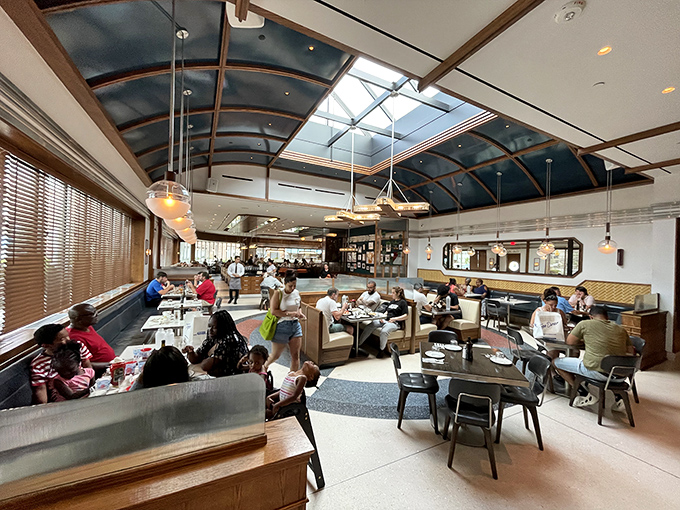 Under that stunning curved ceiling, strangers become neighbors, sharing nothing but space and the universal language of "mmm, this is good." 