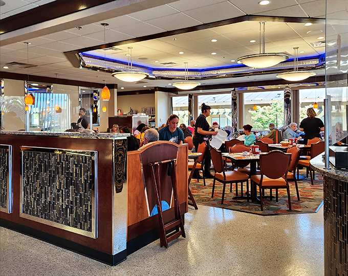 The bustling dining room where strangers become neighbors over coffee refills and the shared understanding that calories don't count before noon.