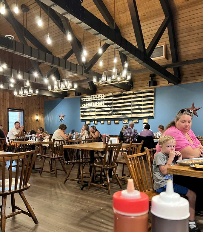 Where barbecue brings families together &ndash; wooden chairs, American flag d&eacute;cor, and sauce bottles standing ready for the serious business of eating.