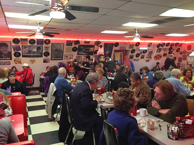 Morning communion at Charlie Parker's: strangers united by coffee, conversation, and the shared religion of exceptional breakfast in a room humming with satisfaction.