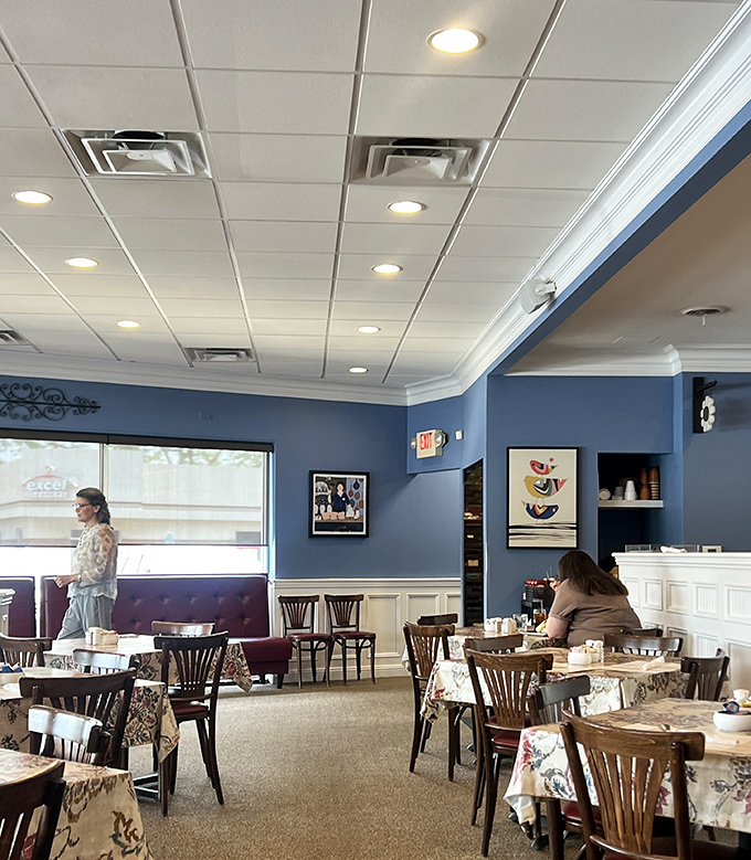 Blue walls and white wainscoting create the perfect backdrop for morning conversations that range from weather to world peace.