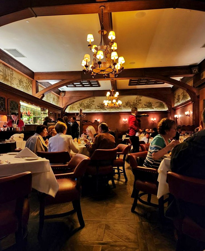 Where time stands still but the service never does. The dining room hums with the energy of a century's worth of special occasions.