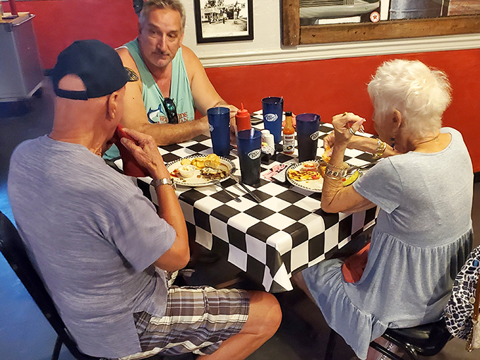 Three generations sharing breakfast and conversation&mdash;the true magic of places like Mrs. Mac's where food brings people together.