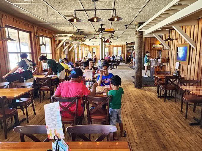 Families gathering around wooden tables, creating memories that will last longer than their sunburns. This is what vacation is all about.