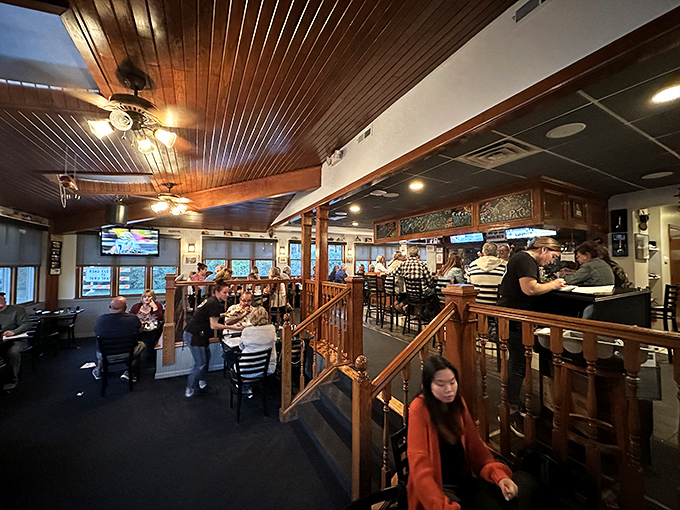 A bustling evening scene where families and friends gather, proving that good food still brings people together better than any social media ever could.