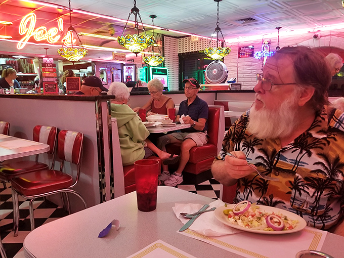 Every booth tells a story, while the red chairs invite you to stay long enough to write your own chapter.