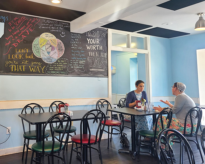 Blue walls and inspirational chalkboard art create the perfect backdrop for conversations that flow as easily as the coffee.