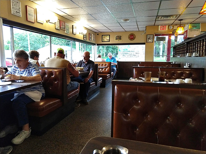 Regulars settle into their favorite booths, creating that perfect diner soundtrack of coffee cups clinking and conversations about everything and nothing.