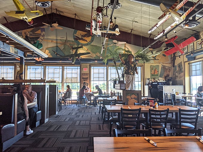Another angle reveals the thoughtful layout of Pilot Pete's interior, where every seat offers a view of flying machines and the promise of a meal worth traveling for.