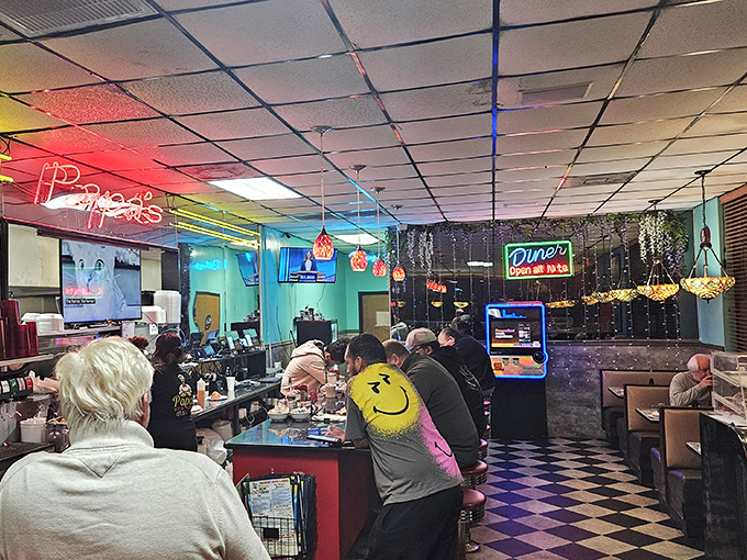 Where locals gather at the counter, proving some of life's best conversations happen over coffee and beneath neon lights.