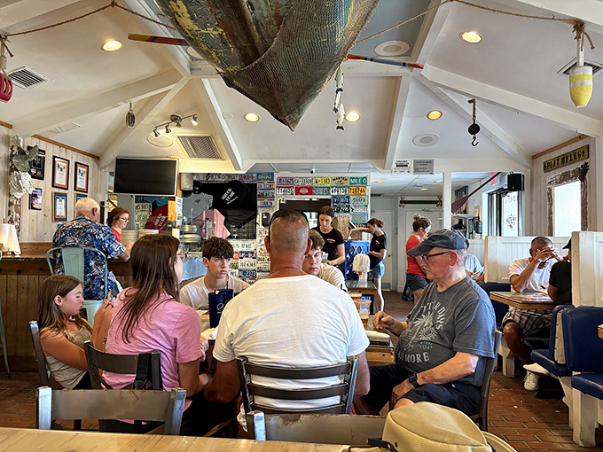 Where strangers become friends over the universal language of "Did you try the lobster roll yet?" Pure Florida dining democracy.