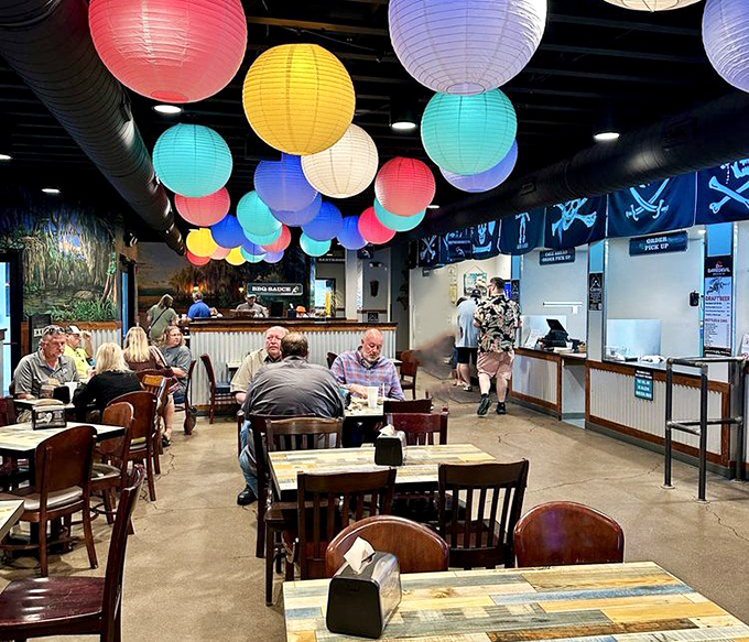 Where barbecue pilgrims gather beneath a constellation of paper lanterns, creating a symphony of satisfied murmurs and the occasional "Oh my goodness."