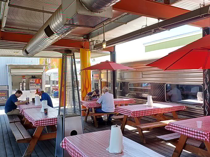 The outdoor dining area proves that picnic tables and checkered tablecloths are the natural habitat for proper BBQ consumption&mdash;as nature intended.