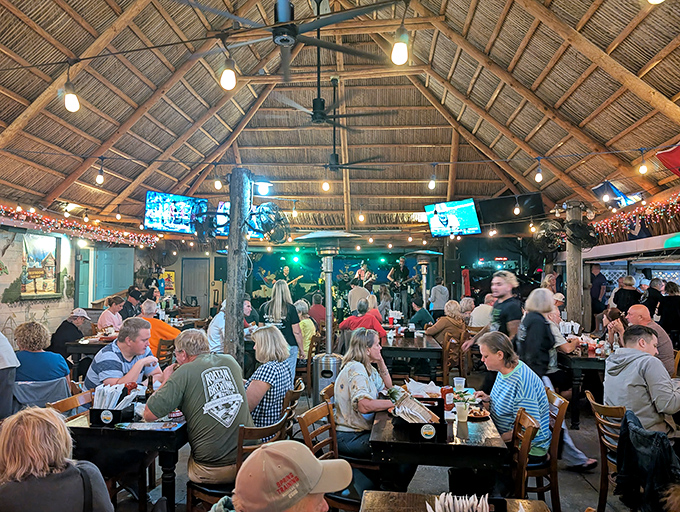 Under that soaring thatched roof, strangers become friends and first-timers become regulars. Florida dining at its most authentic.