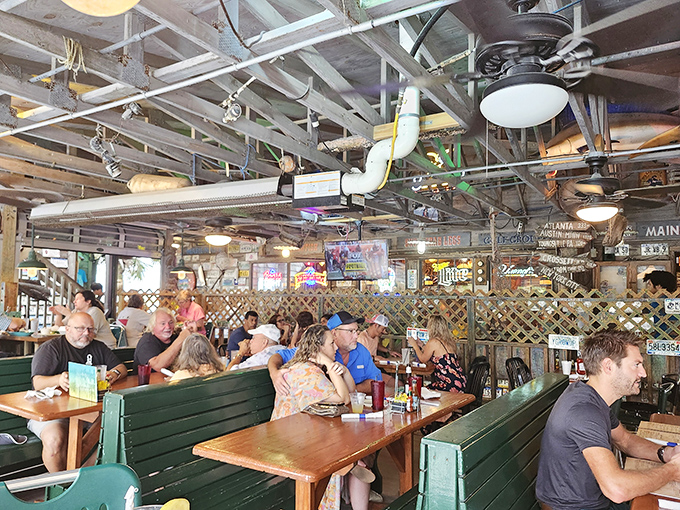 Where strangers become friends over cold drinks and seafood stories. The bar's weathered wood has heard every fish tale&mdash;some of them true.