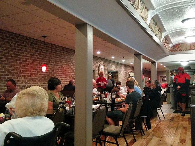 Where locals and visitors break bread together under brick walls that have heard decades of good conversations. The restaurant equivalent of a community hug.