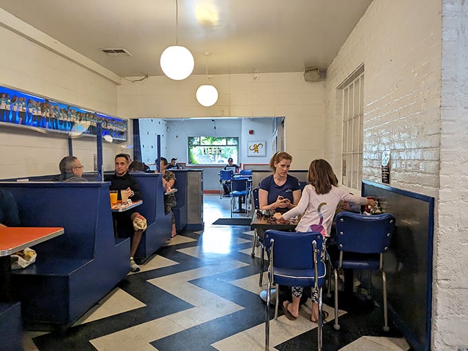 The chevron floor pattern leads your eye right to where the magic happens&mdash;tables filled with happy diners enjoying their meals.