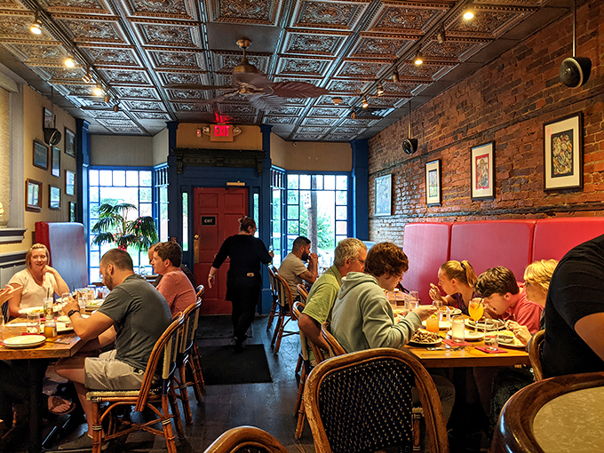 The universal language of good food brings strangers together in this cozy dining room. Notice nobody's looking at their phones?