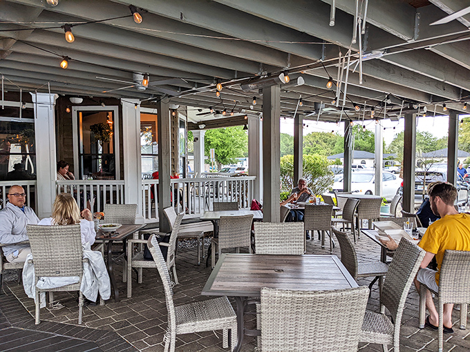 Outdoor dining where gentle breezes complement every bite &ndash; nature's version of dinner and a show, Florida-style.