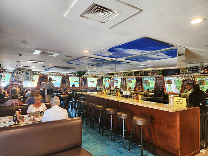The bar area buzzes with locals and travelers sharing stories over cold drinks. Some came for the food, all stay for the atmosphere.